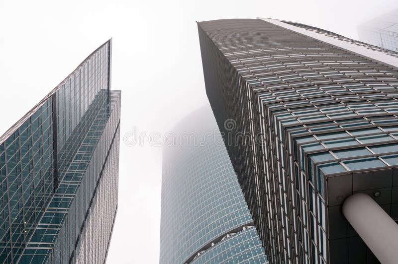 Bottom View of Modern Skyscapers in Fog Stock Image - Image of ...