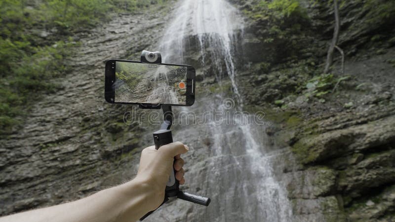 Bottom View of Mountains and Waterfall through the Smartphone Camera ...