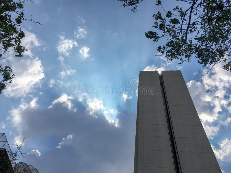 Bottom View of Office Building on Clouds Blue Sky with Sunlight ...
