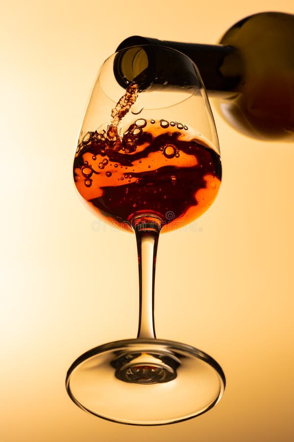 Bottom View of Red Wine Being Poured from the Wine Bottle Stock Image ...