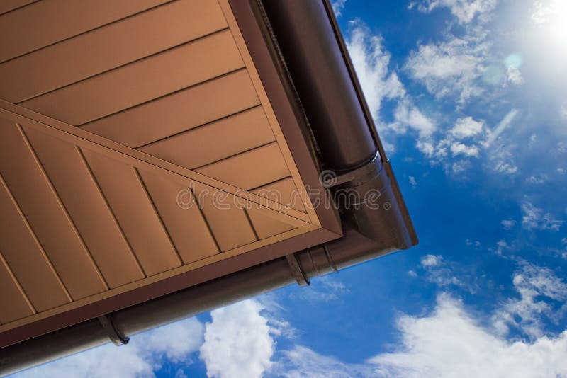 Bottom View on Roof Gutter Pipeline Sysem on Corner of House Against ...