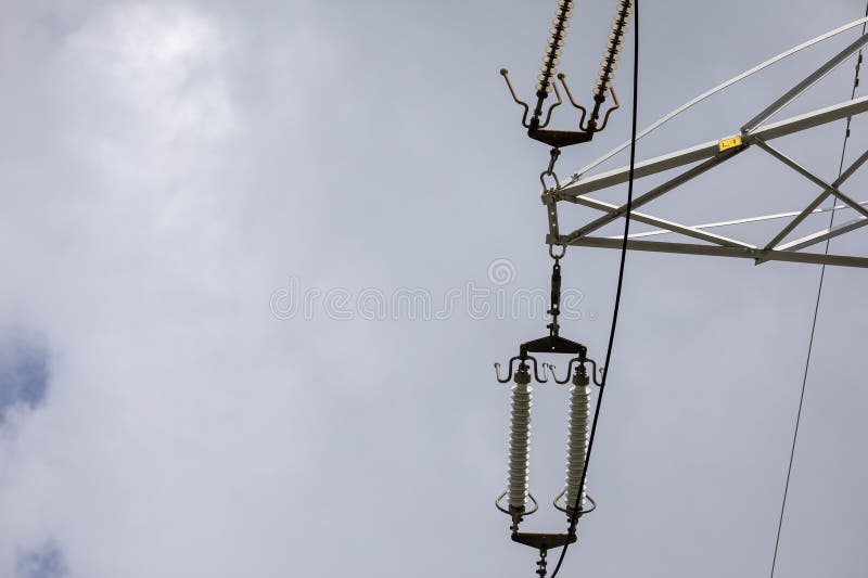 View from Below of the Tall Poles of the High-voltage Overhead Line ...