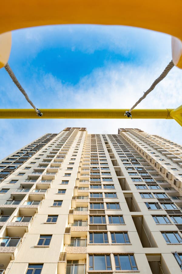 Bottom View of Swing Nearby a Residential Building Vertical Composition ...