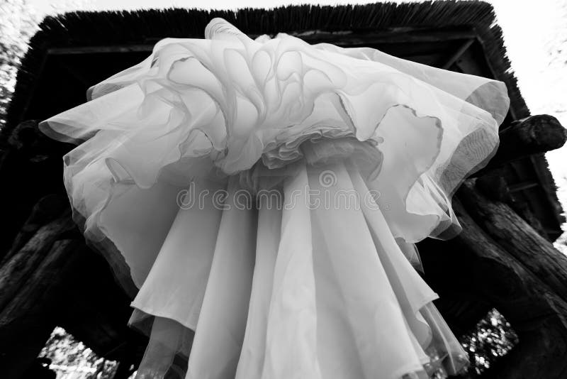 Bottom View of Wedding Dress Hanging on the Arbor Stock Photo - Image ...