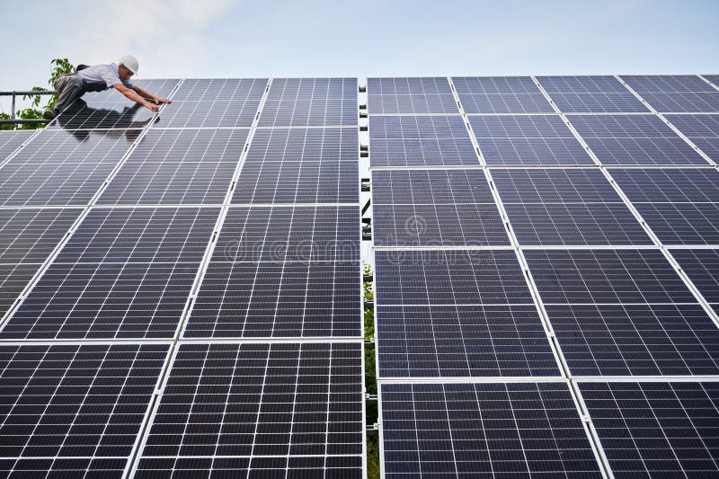 Bottom View of Worker Checking Solar Inverter Work. Stock Image - Image ...