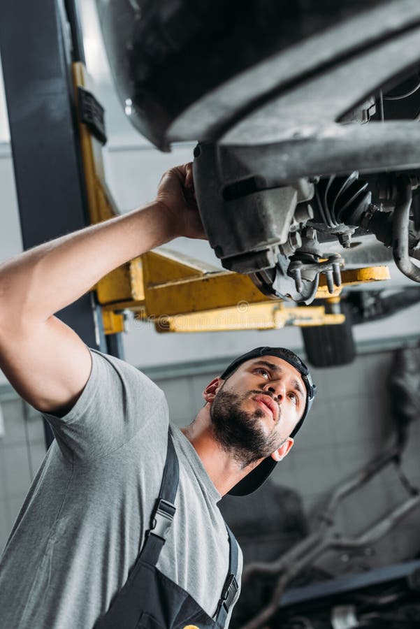 Workman Mechanic Working Under Car in Auto Repair Shop Stock Photo ...