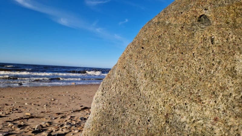 Boulder Close-up with Ocean Waves Background Stock Photo - Image of ...