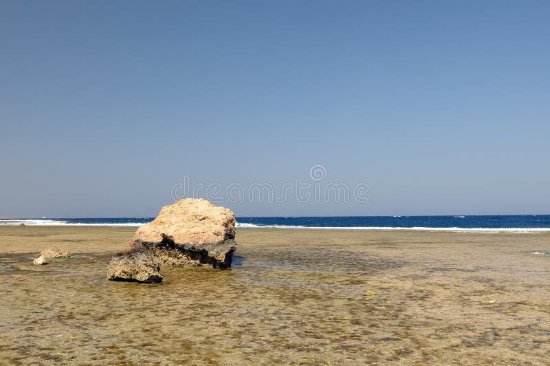 Boulder on beach by ocean stock image. Image of single - 6571039