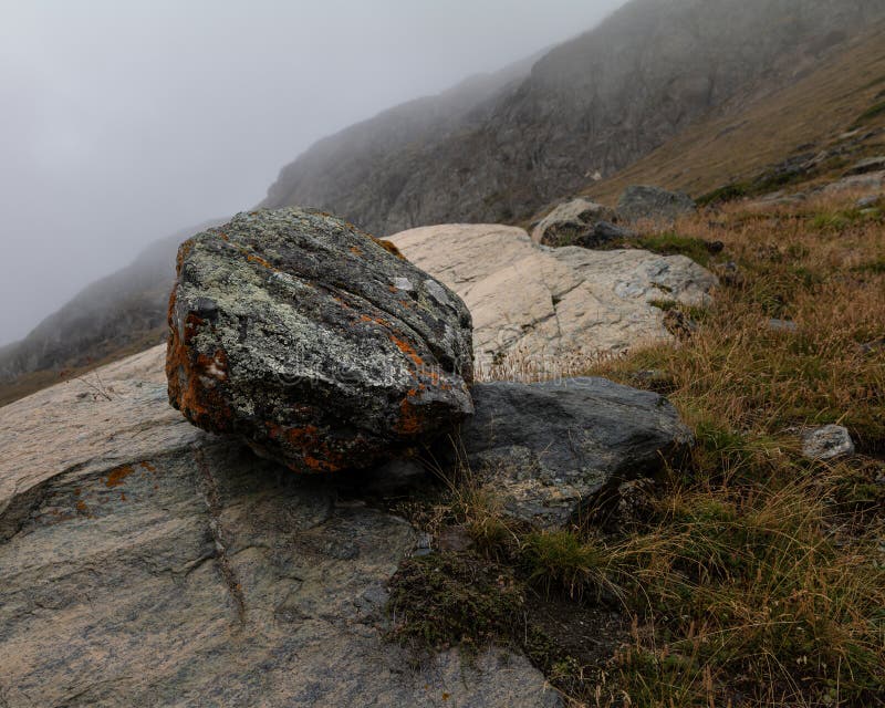 Boulder on a Rocky Hillside Against the Backdrop of the Misty Sky Stock ...