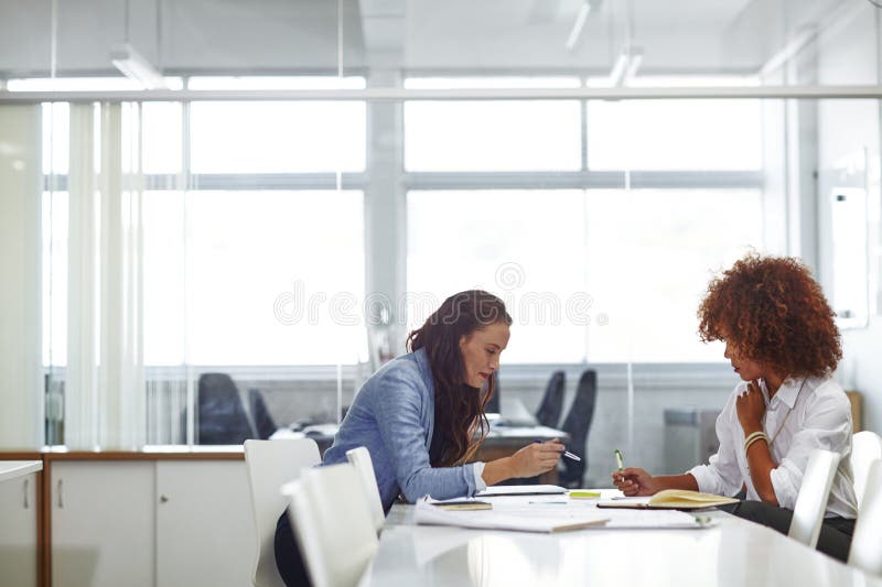 Bouncing Ideas Off One Another. Two Young Female Designers Discussing ...
