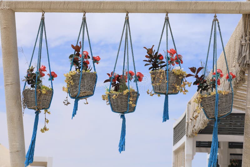 Bouquet of Artificial Flowers in Basket on a Rope Stock Photo - Image ...