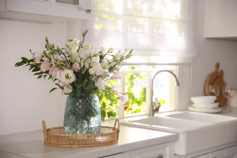 Bouquet of Beautiful Flowers on Countertop in Kitchen, Space for Text ...