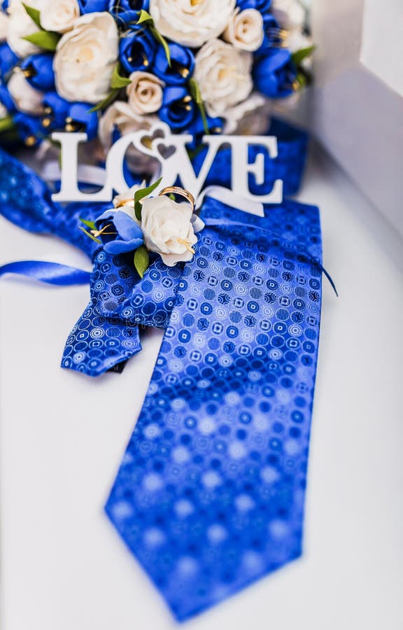 A Bouquet of the Bride from White and Blue Roses and Wedding Rings from ...