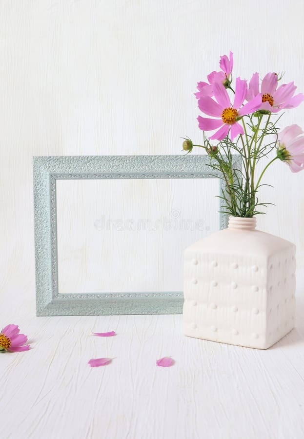 Bouquet of Delicate Flowers in a White Vase with a Gray Frame on a ...