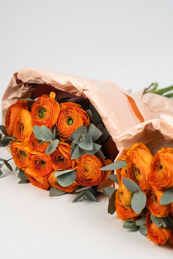 A Bouquet of Bright Orange Ranunculus Close-up. Stock Image - Image of ...