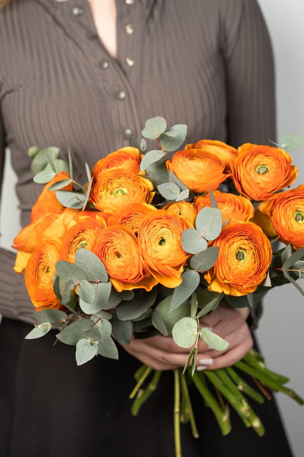 A Bouquet of Bright Orange Ranunculus Close-up. Stock Image - Image of ...