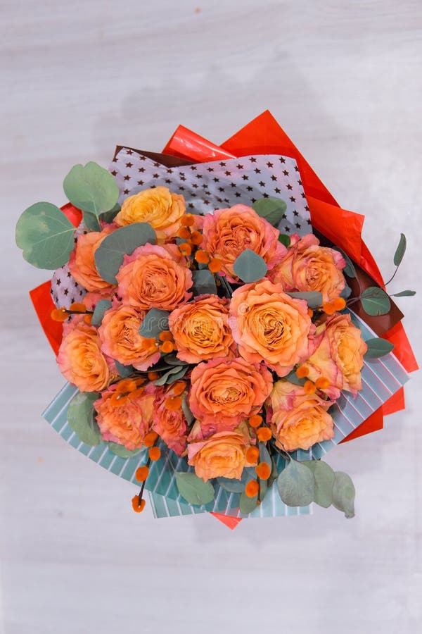 Bouquet of orange roses stock image. Image of beautiful - 145741077