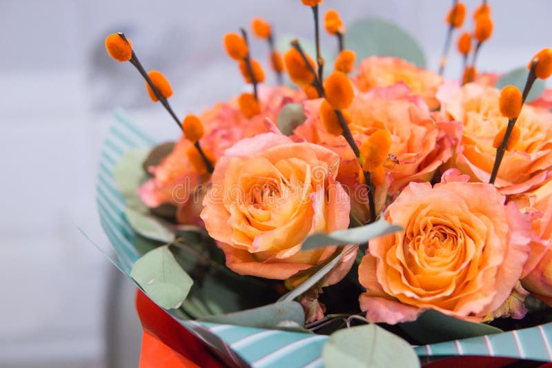 Bouquet of orange roses stock photo. Image of basket - 145741318