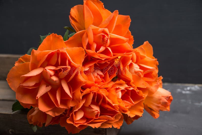 Bouquet with Orange Roses on the Rustic Background Stock Image - Image ...