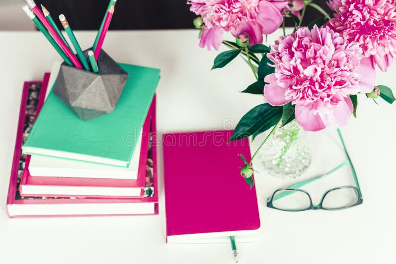 Bouquet of Pink Peonies, a Stack of Books, Pencils and a Notebook on a ...