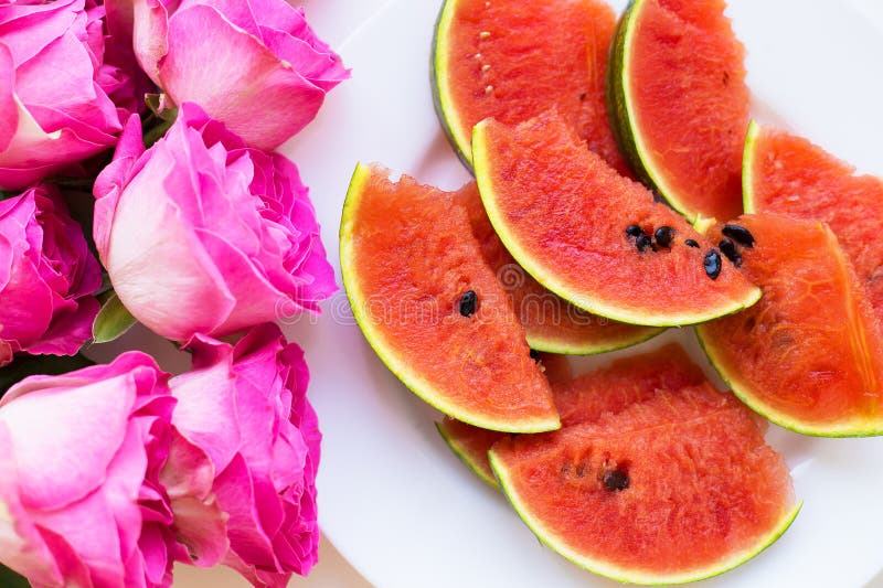 Bouquet of Pink Roses on the Table with Watermelon Stock Photo - Image ...