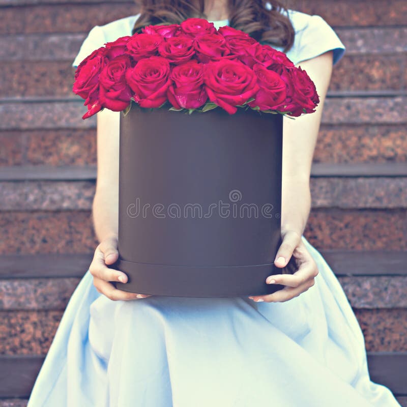 Bouquet of Red Roses in a Box Stock Image - Image of bunch, hands: 68389179
