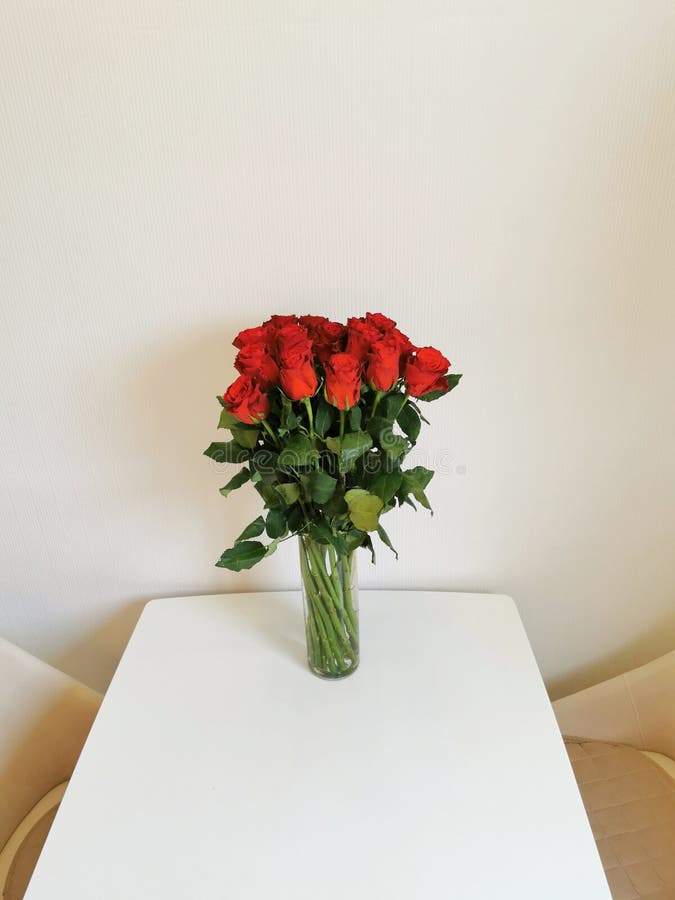 Bouquet of Red Roses in a Glass Vase on the Table. Stock Image - Image ...
