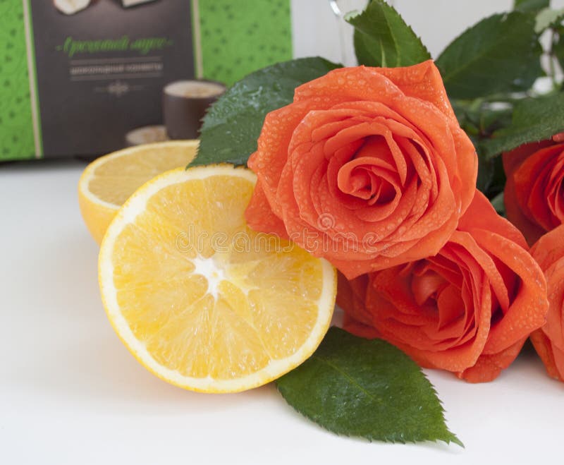 Bouquet of Roses and Fresh Orange with a Box of Chocolates Stock Image ...