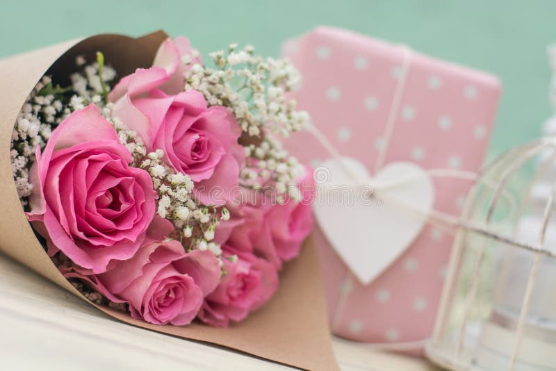 Bouquet of roses and gift stock image. Image of valentines - 102434331