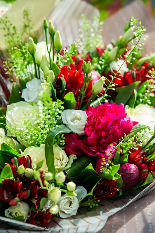 Bouquet of Small Multi-colored Roses Stock Photo - Image of brick ...