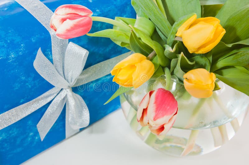 Bouquet of tulips and gift stock image. Image of beautiful - 18879681