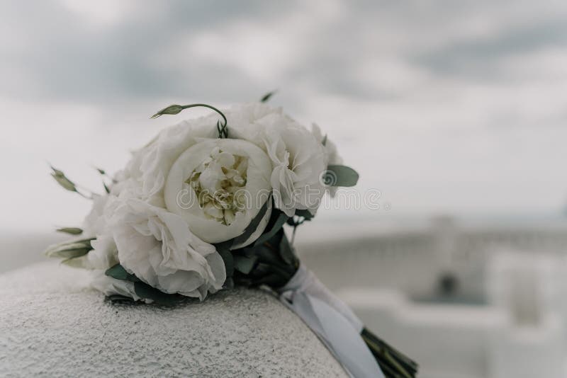A Bouquet of White Flowers is Sitting on a White Surface. the Flowers ...
