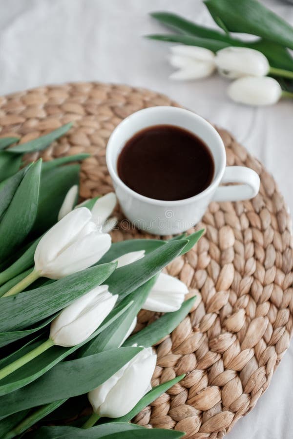 A Bouquet of White Tulips and a Cup of Coffee on a Table. Cozy Home ...