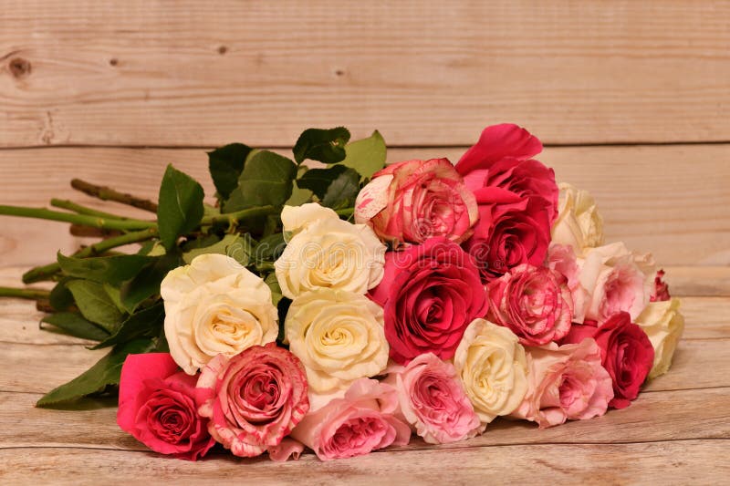 A Bouquet of Yellow and Pink Roses Lies on the Table Stock Photo ...