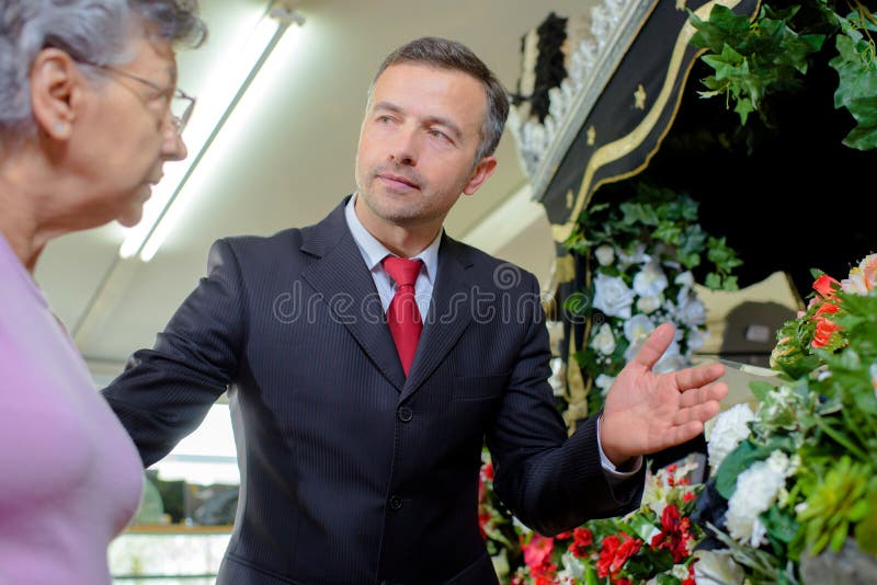 Bouquets in funeral shop stock photo. Image of women - 86207654