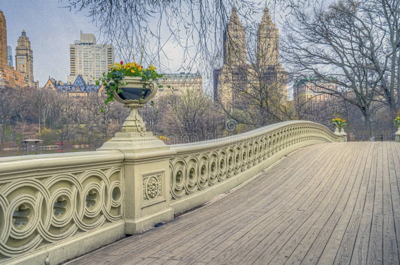 Bow bridge in early spring stock image. Image of lake - 243201947
