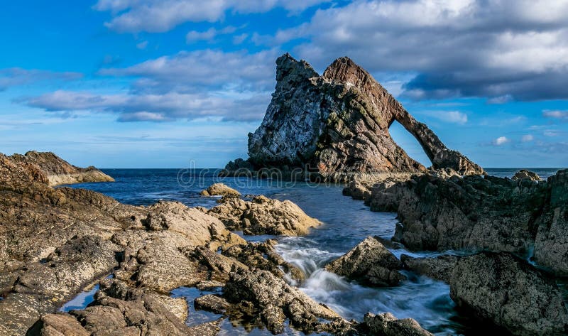 Bow Fiddle Rock with a Cloudy Blue Sky in the Background in Scotland ...