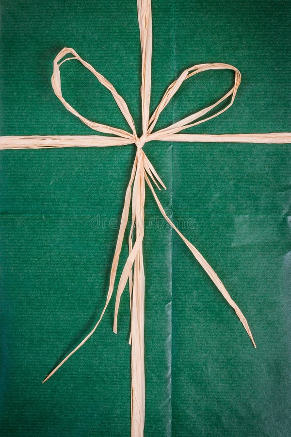 Bow on green paper package stock image. Image of gift - 61363119