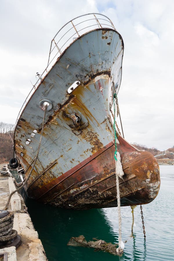 Bow of an Old Abandoned Ship Hangs Over the Sea Stock Image - Image of ...