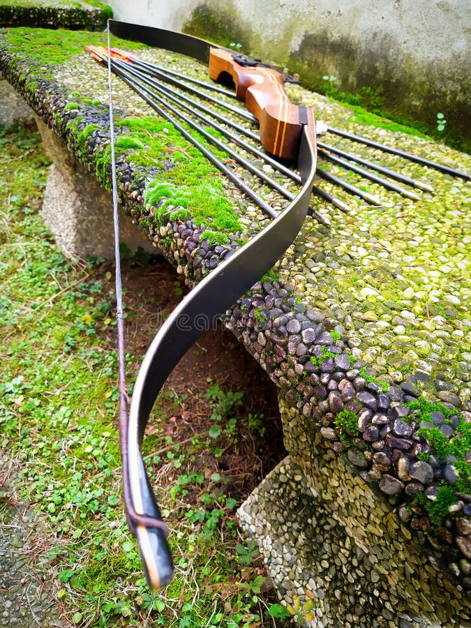 Bow for Shooting and Arrows on a Stone Bench Stock Photo - Image of ...