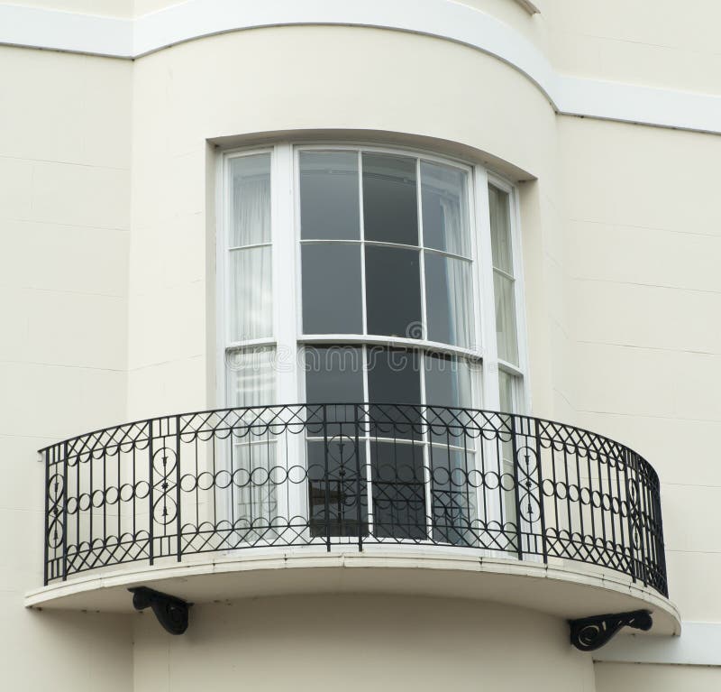 Bow Window with Narrow Balcony on a White Building Stock Image - Image ...