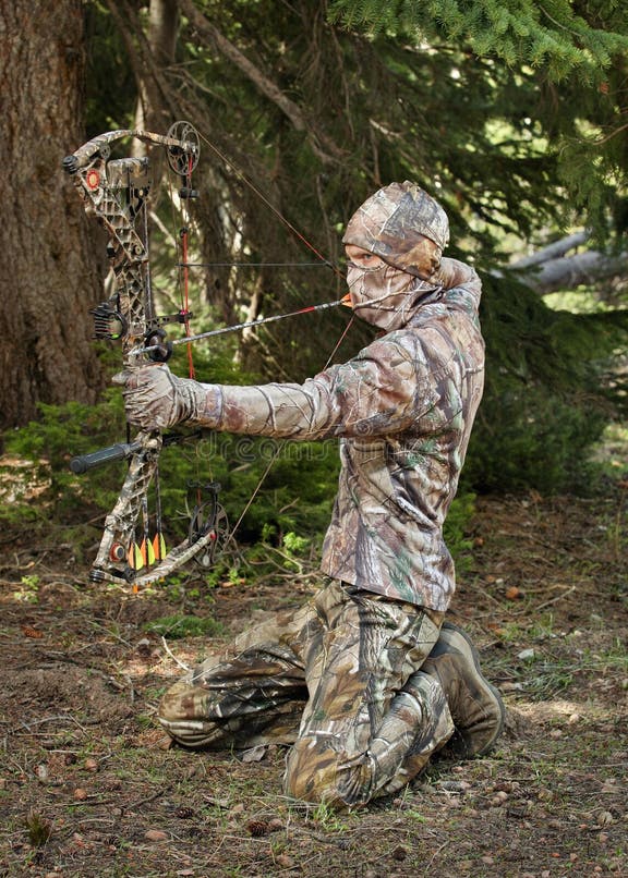 Bowhunter Kneeling and Drawing Bow Stock Image - Image of kneeling ...