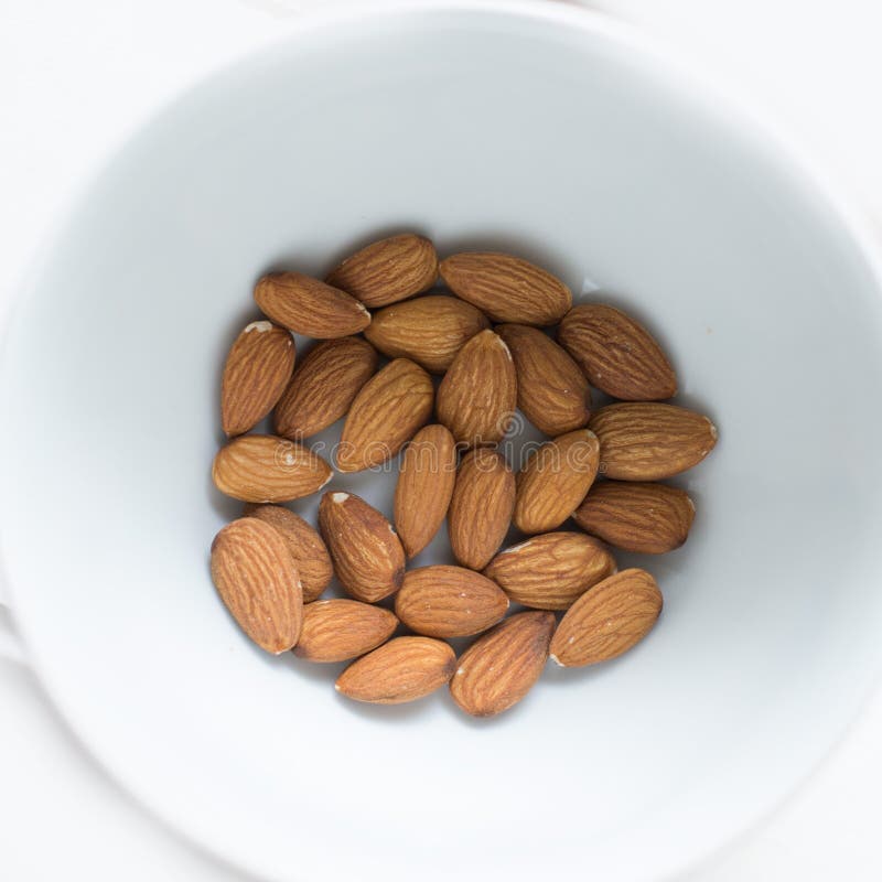 Bowl of Almonds stock photo. Image of bowl, brown, white - 83036386