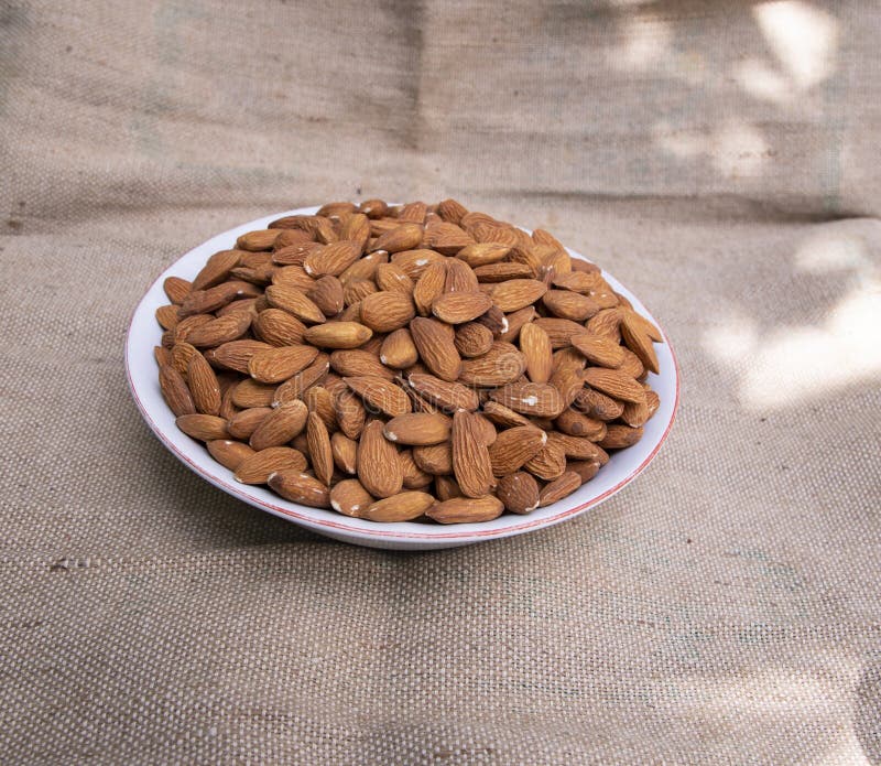 Almonds on jute surface stock image. Image of drupe, group - 28370619