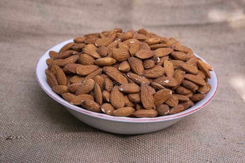 Almonds on jute surface stock image. Image of drupe, group - 28370619