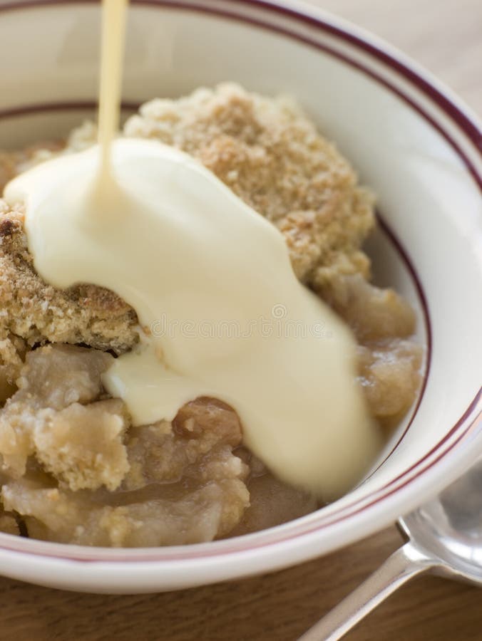Apple crumble with custard stock image. Image of dessert - 18910709