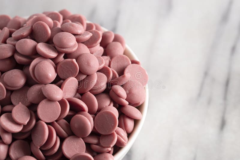 Bowl of Authentic Ruby Chocolate Drops on a Marble Counter Stock Image ...