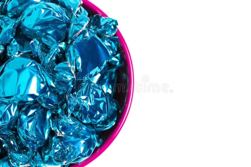A Bowl of Blue Wrapped Candy on a White Background Stock Photo - Image ...
