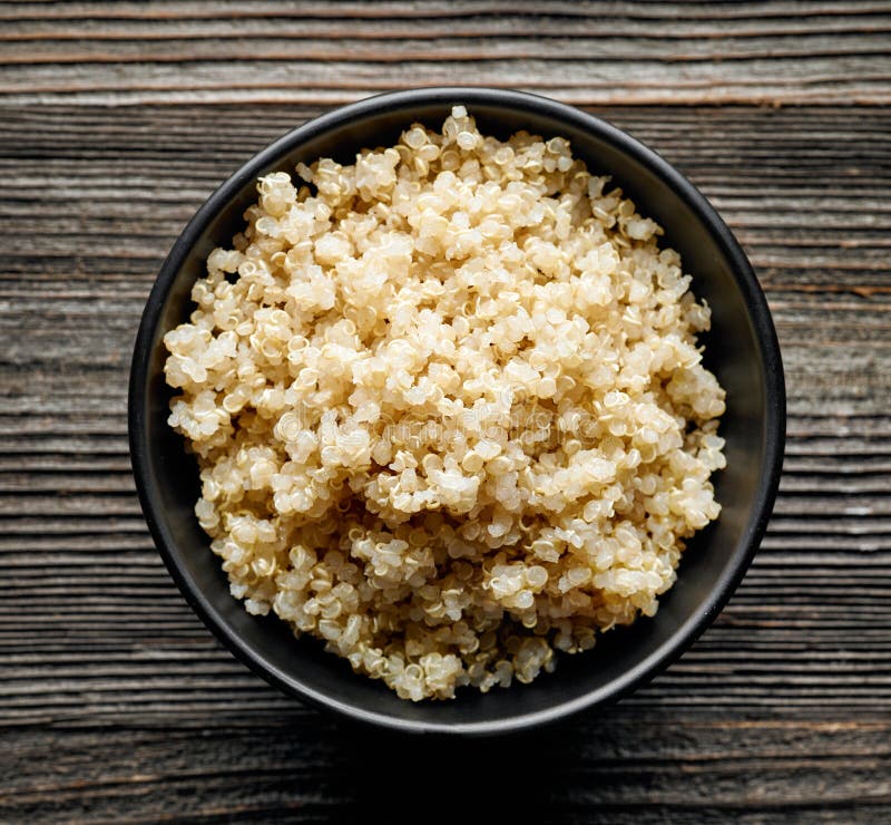 Bowl of boiled Quinoa stock photo. Image of grain, table - 64734178