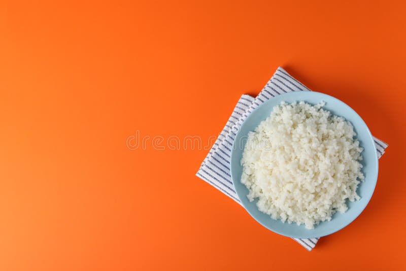 Bowl with Boiled Rice on Orange Background Stock Image - Image of ...